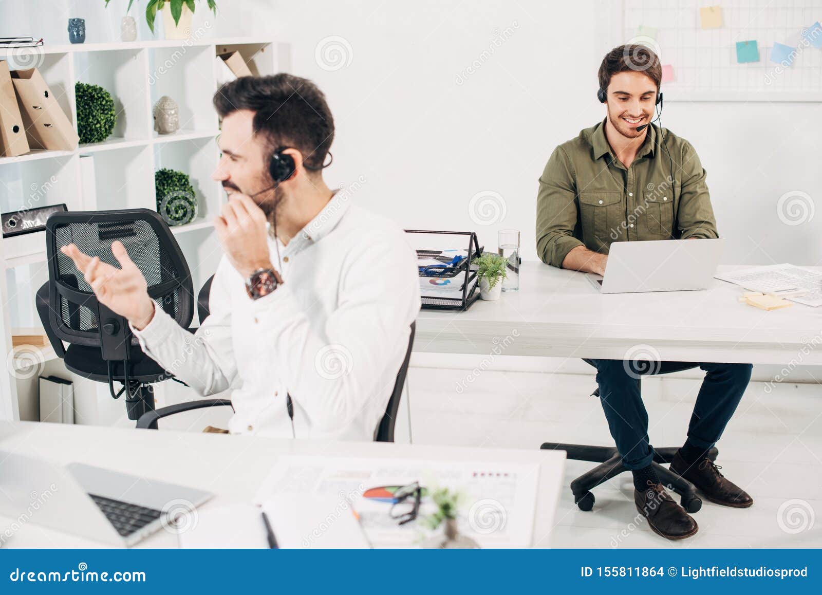 Male Operators Using Headsets while Working Stock Photo - Image of ...