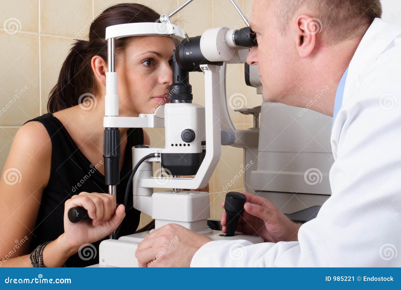 Male Ophthalmologist Conducting an Eye Examination Stock Image - Image ...