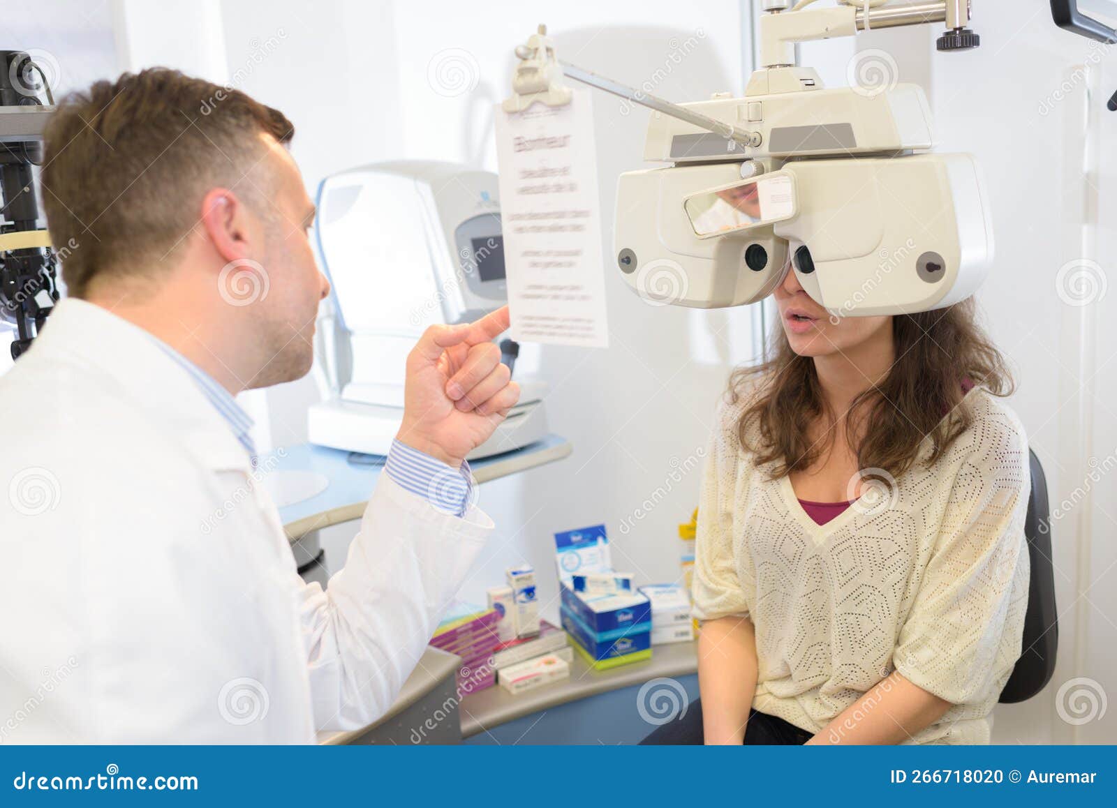 Male Optometrist Doing Sight Testing for Female Patient Stock Photo ...