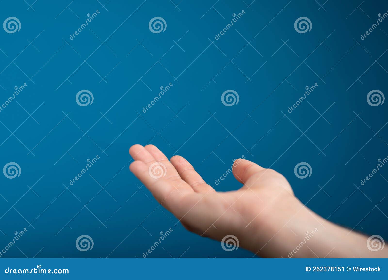 Male with an Outstretched Hand with an Open Palm on a Blue Background ...