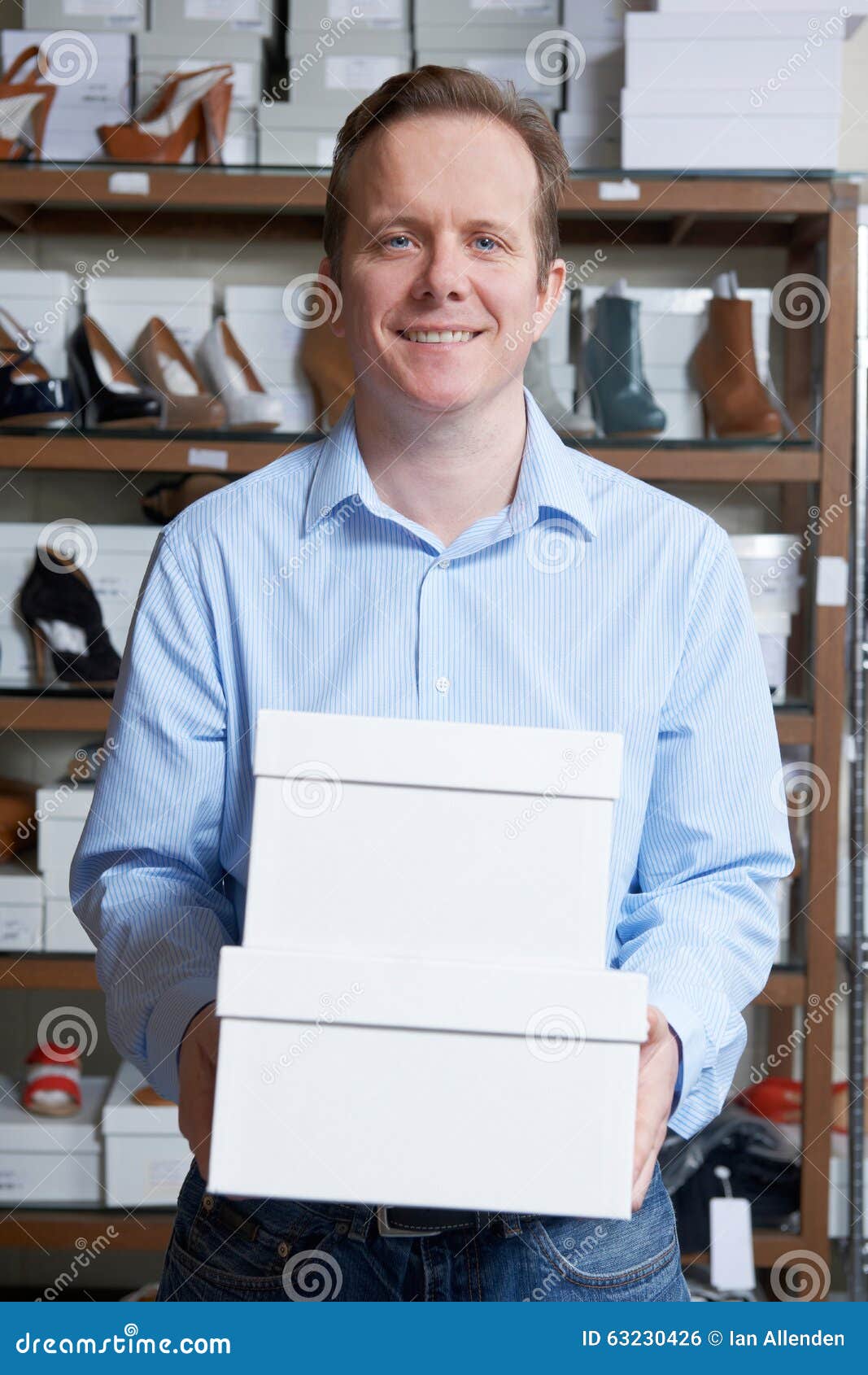 Male Owner of Shoe Store Carrying Boxes Stock Photo - Image of ...
