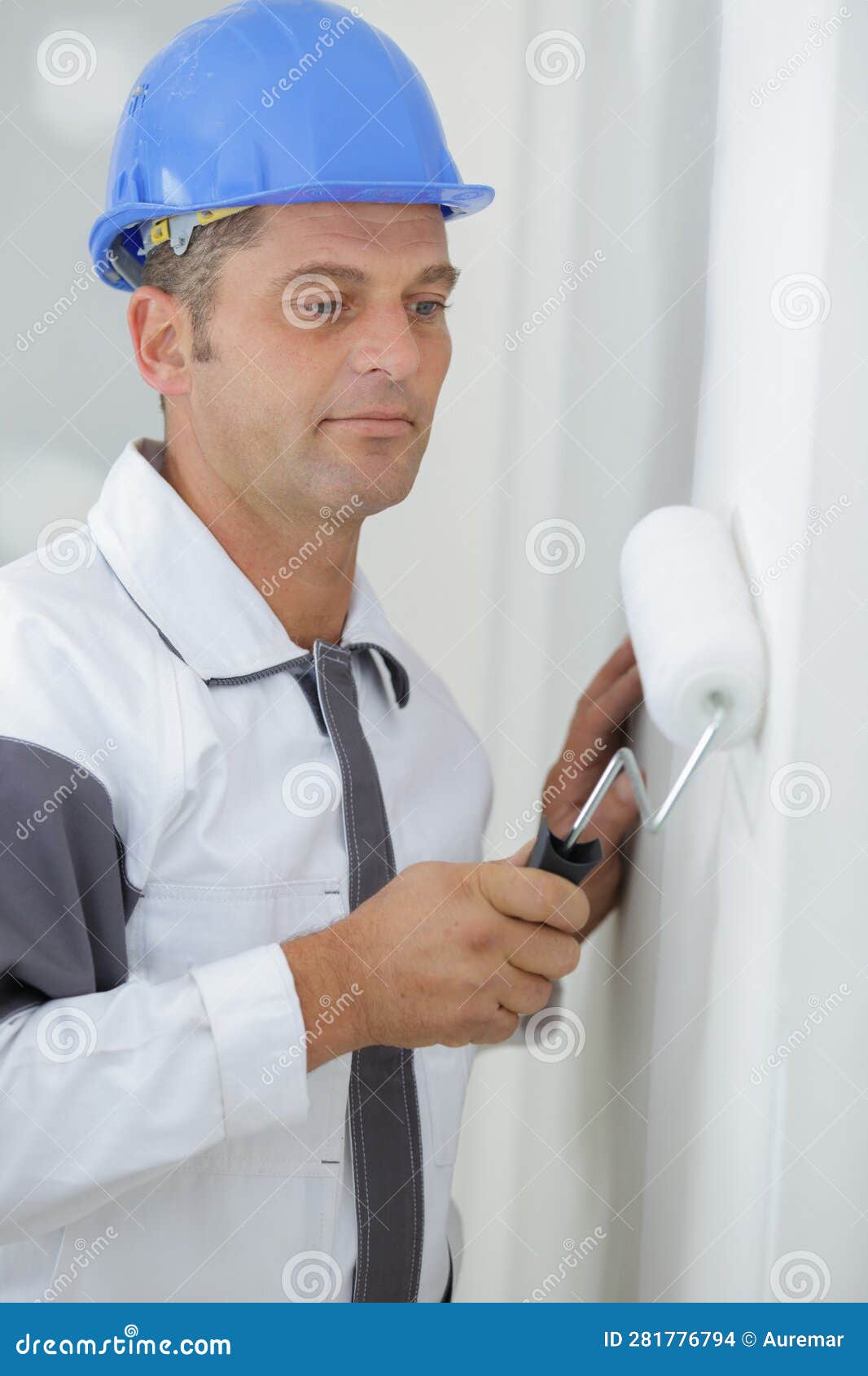 Male Painter Using Roller on Wall Stock Photo - Image of repair ...