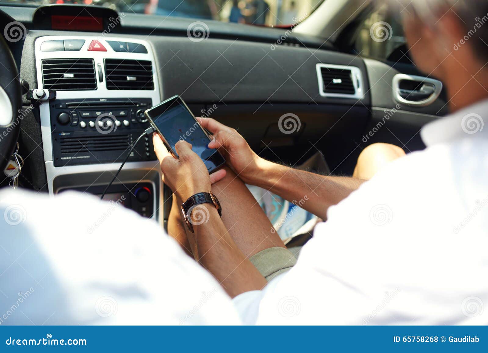 Male Passenger Using Mobile Smart Phone for Navigation Application with ...