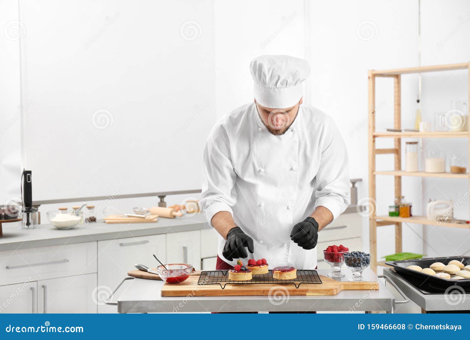 Male Pastry Chef Preparing Desserts at Table Stock Photo - Image of ...
