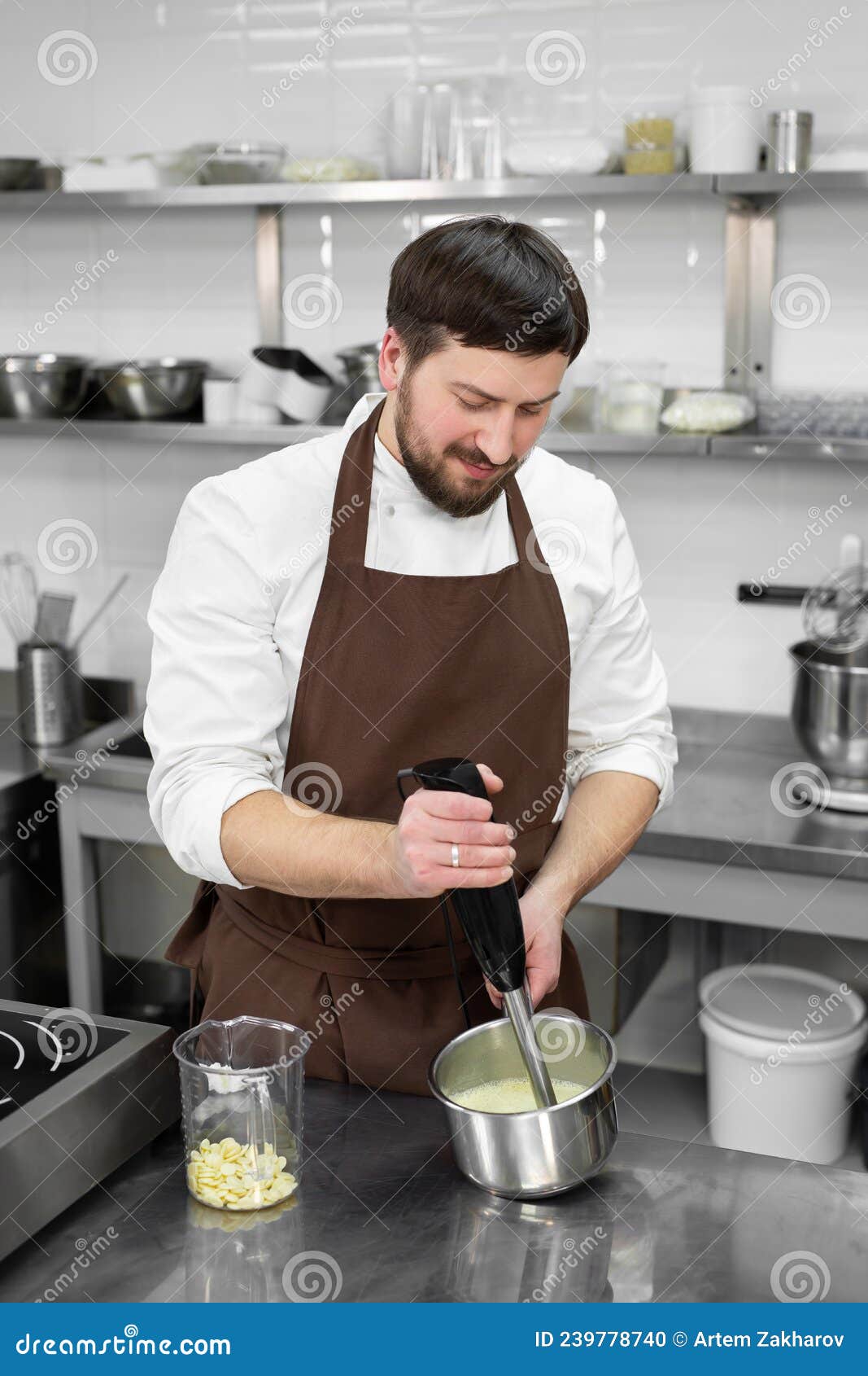 Male Pastry Chef Whips Up a Mirror Icing with White Chocolate for a ...