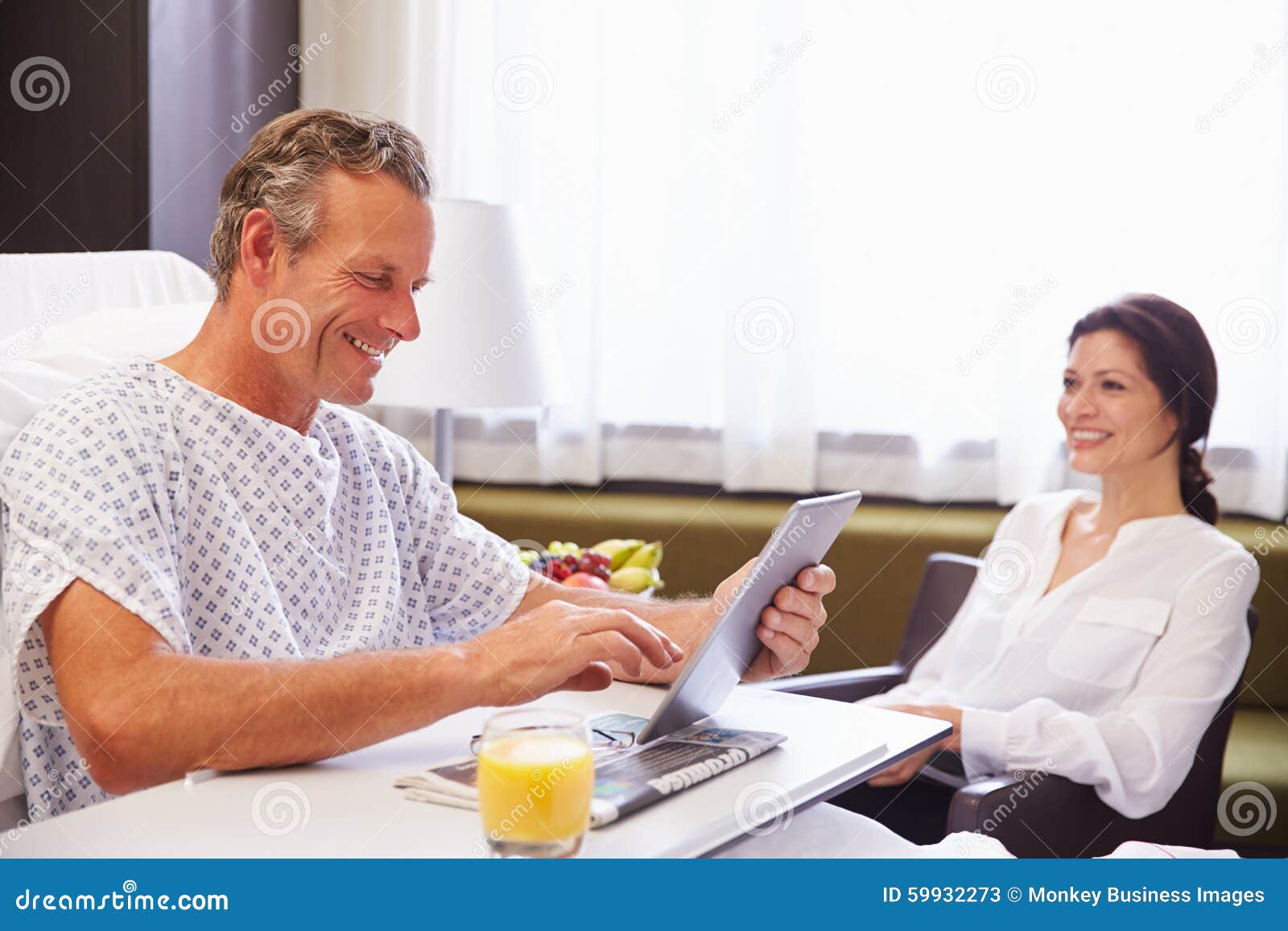 Male Patient in Hospital Bed Using Digital Tablet Stock Image - Image ...
