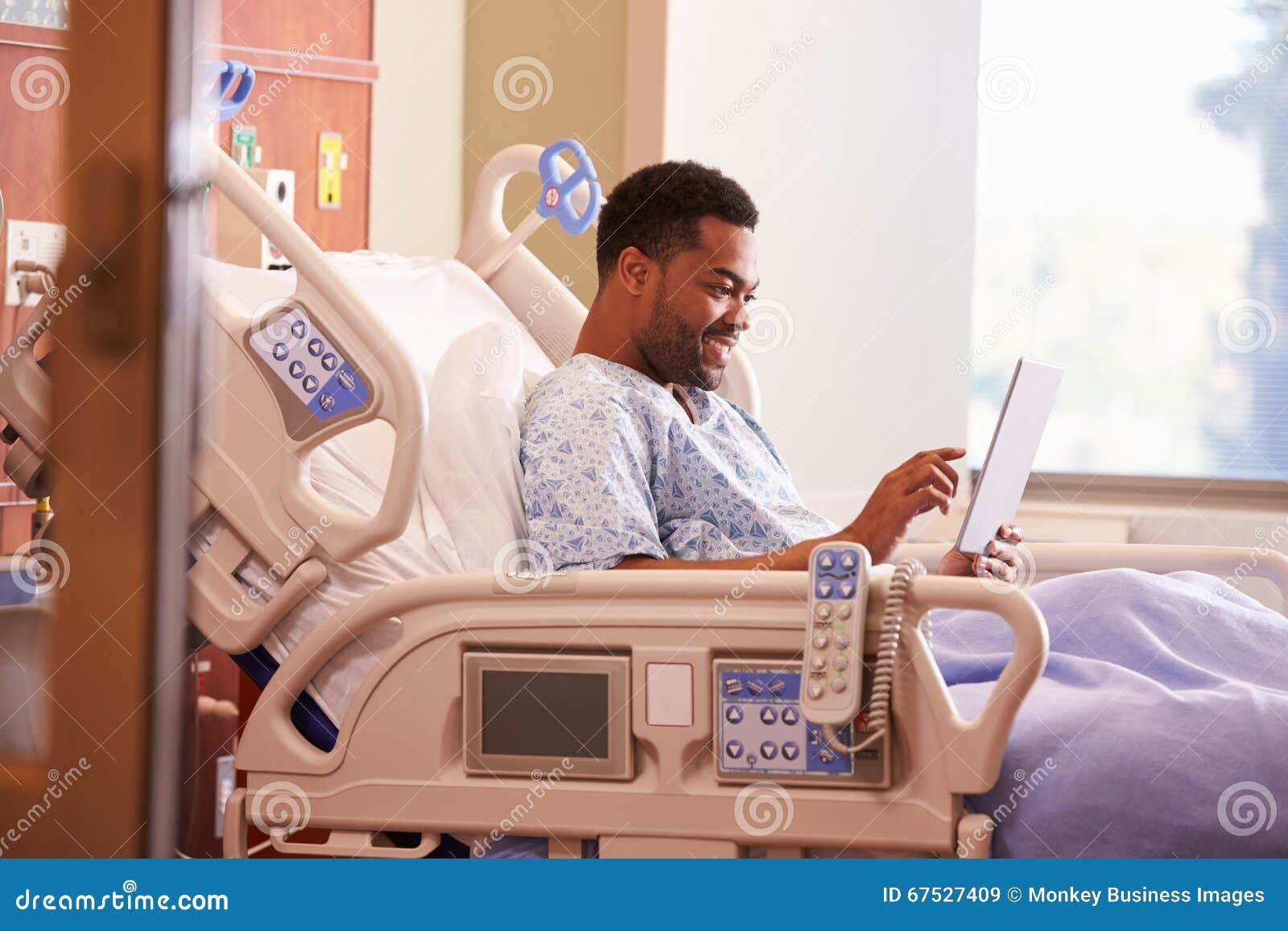 Male Patient in Hospital Bed Using Digital Tablet Stock Image - Image ...