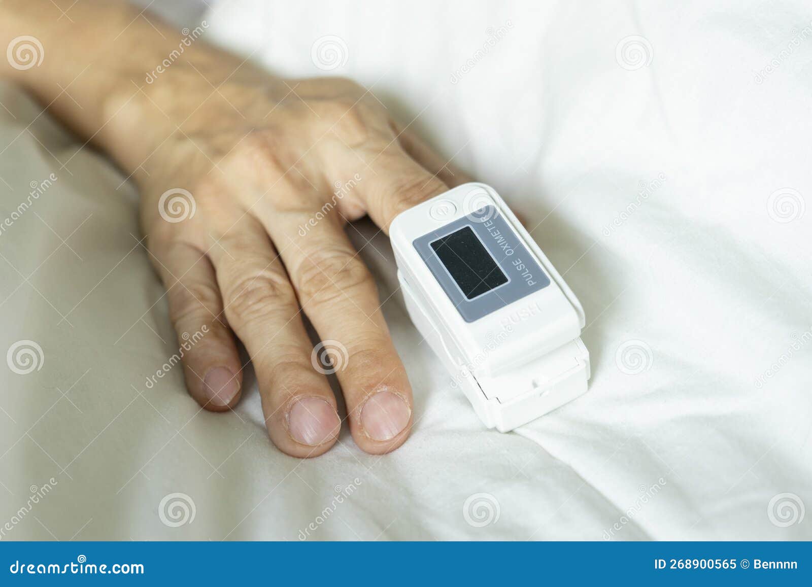 Male Patient Using Oximeter on Finger Lying in Bed. Stock Image - Image ...