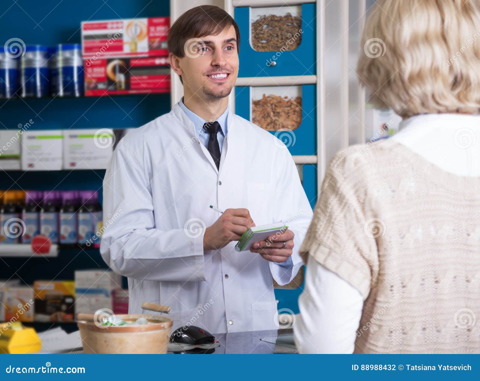 Male Pharmacist Talking To Customer at Pharmacy Stock Photo - Image of ...