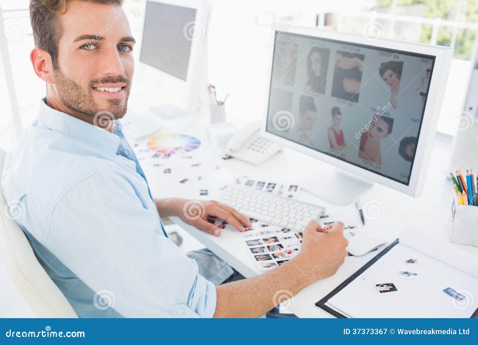 Male Photo Editor Working on Computer in a Bright Office Stock Image ...