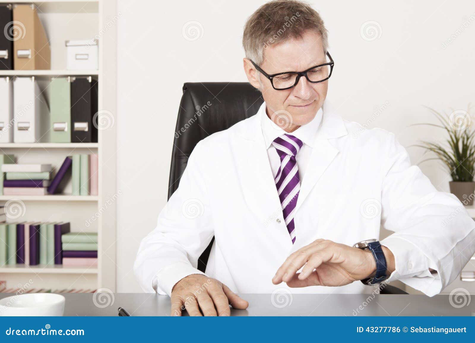 Male Physician Watching Wrist Watch Stock Photo - Image of adult ...