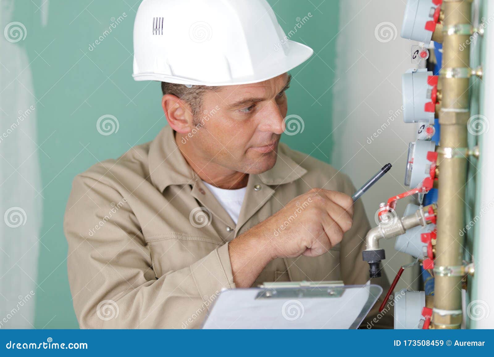 Male Plumber Fixing Water Meter with Adjustable Wrench Stock Image ...