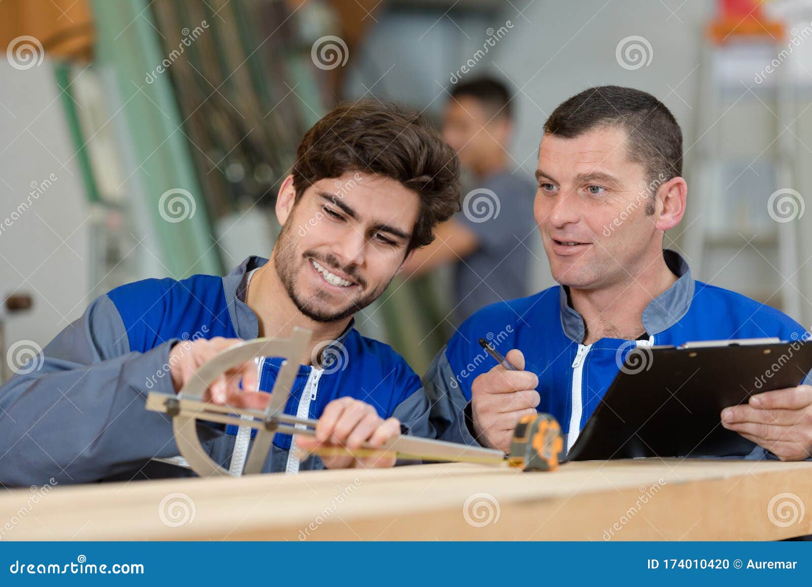 Male Plumber Measuring Level in Workshop Stock Photo - Image of metal ...