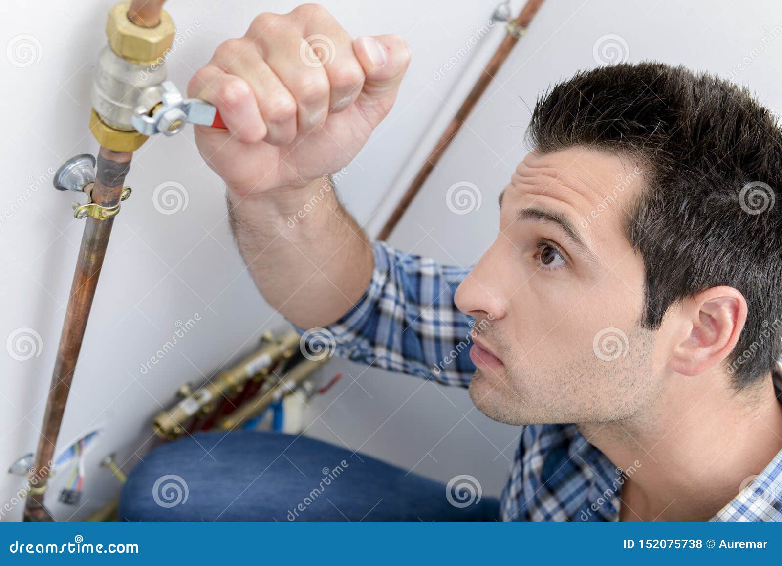 Male plumber at work stock photo. Image of professional - 152075738