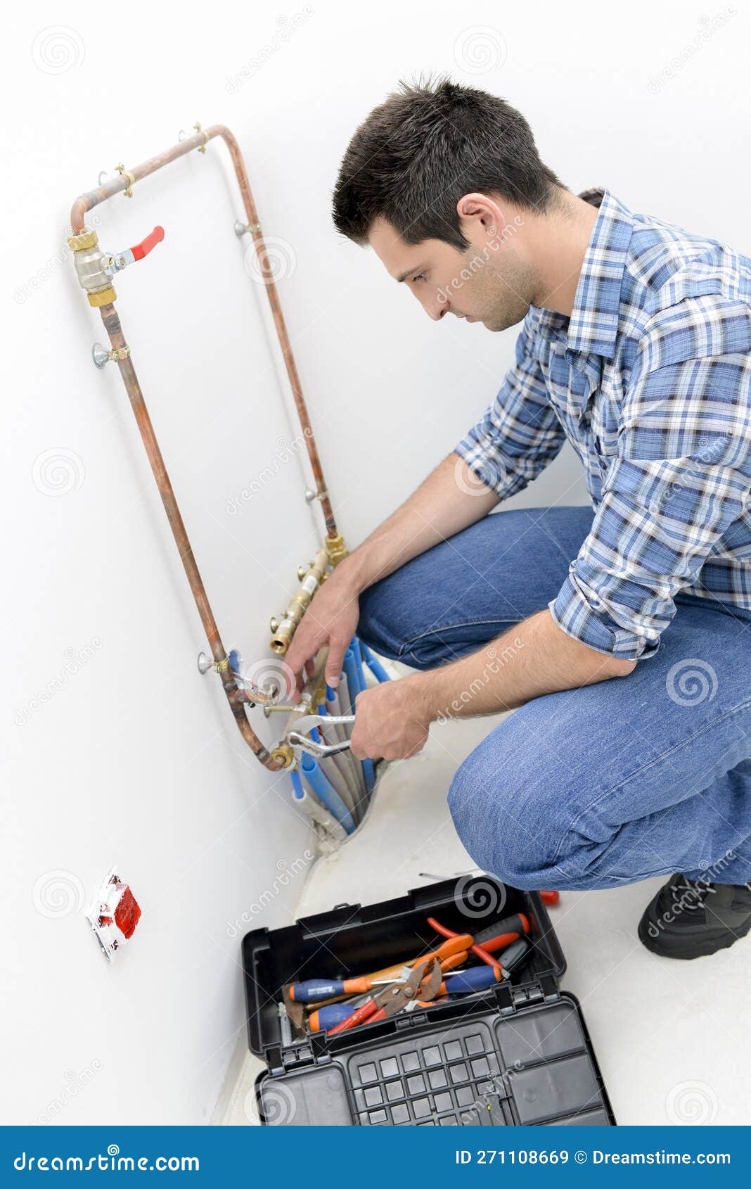 Male plumber at work stock image. Image of profession - 271108669