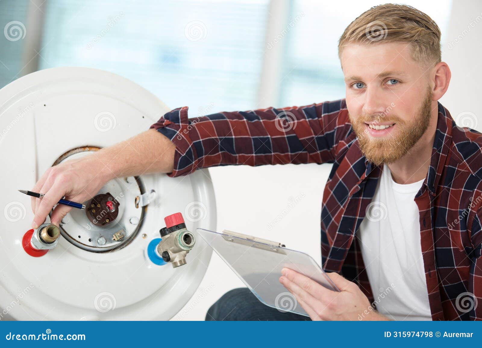 Male Plumber Working on Central Heating Boiler Stock Photo - Image of ...