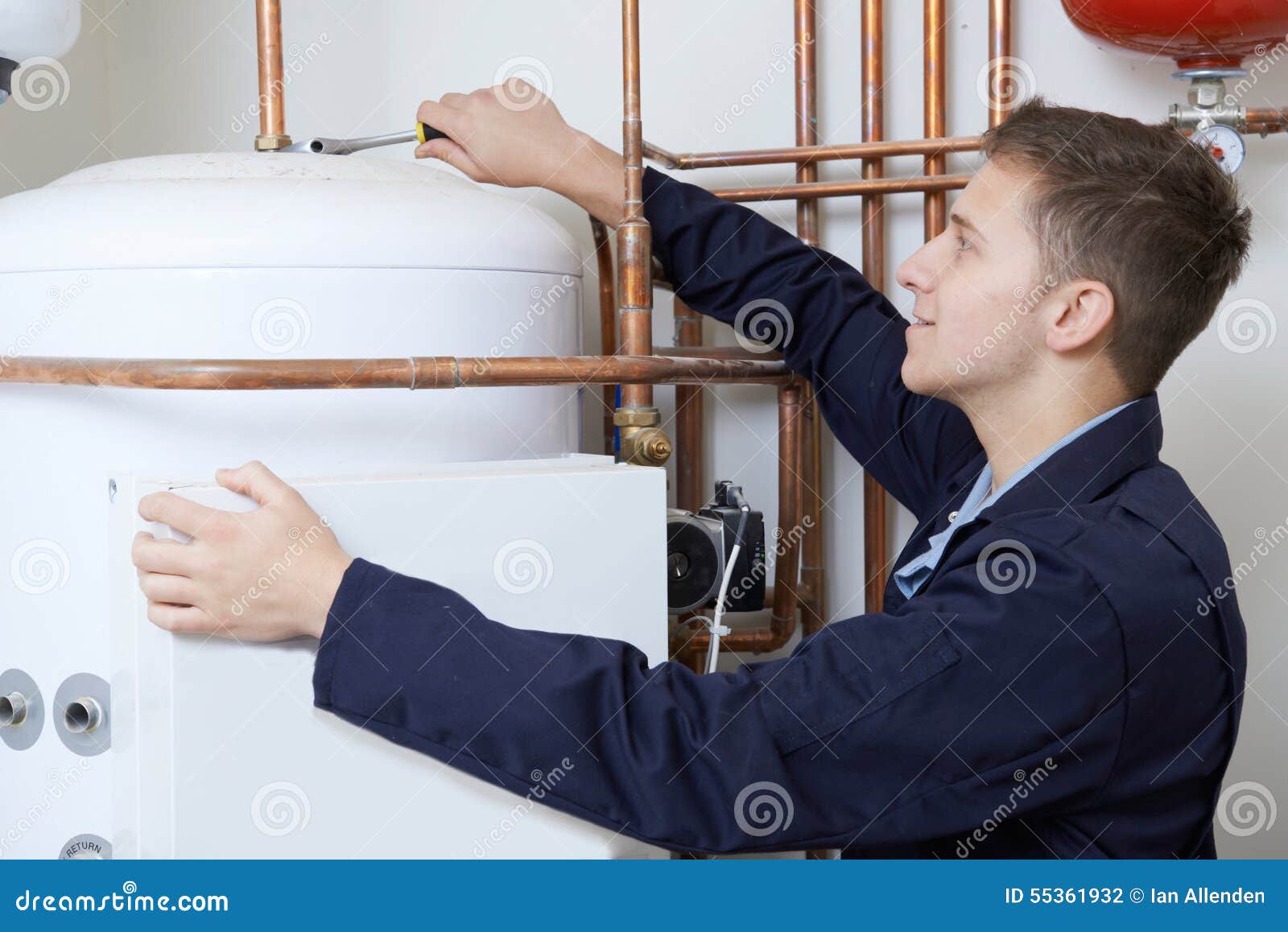 Male Plumber Working on Central Heating Boiler Stock Photo - Image of ...