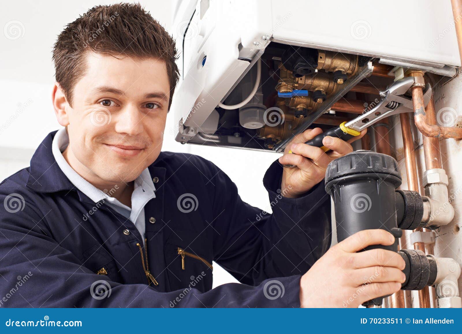 Male Plumber Working on Central Heating Boiler Stock Image - Image of ...