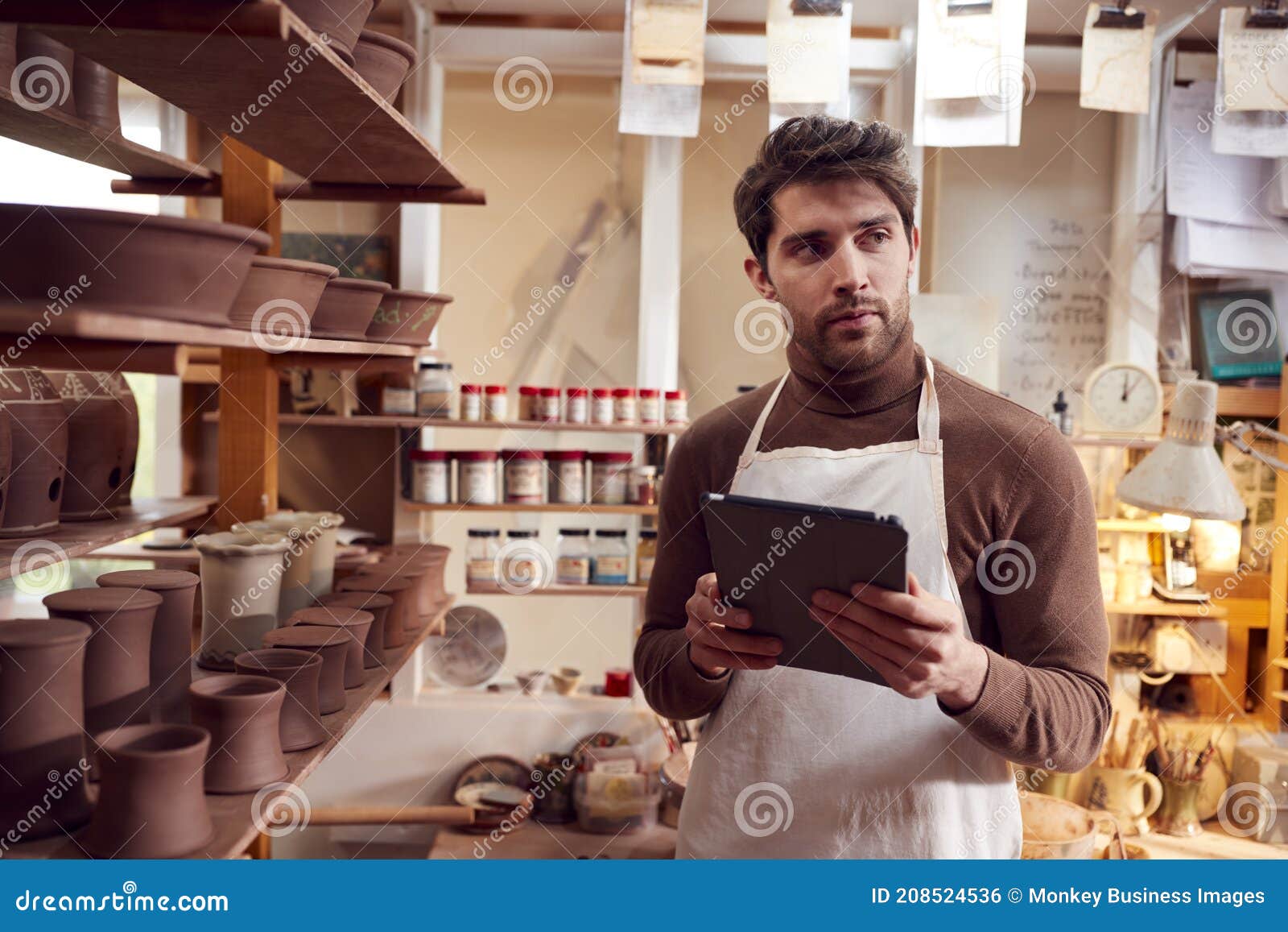 Male Potter Working With Female Apprentice. Working With Clay Lump On ...