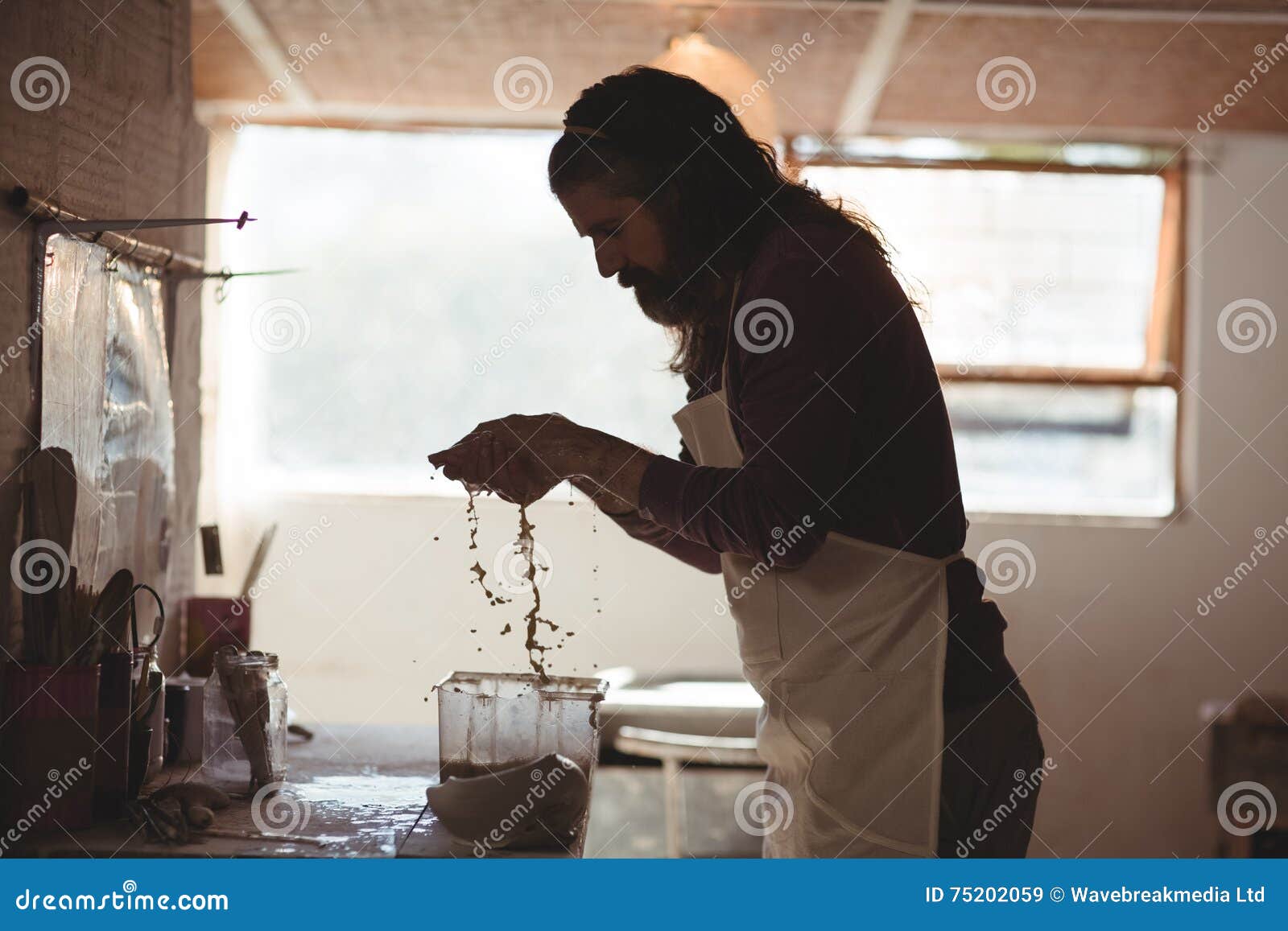 Male Potter Washing Hands after Working on Pottery Wheel Stock Image ...
