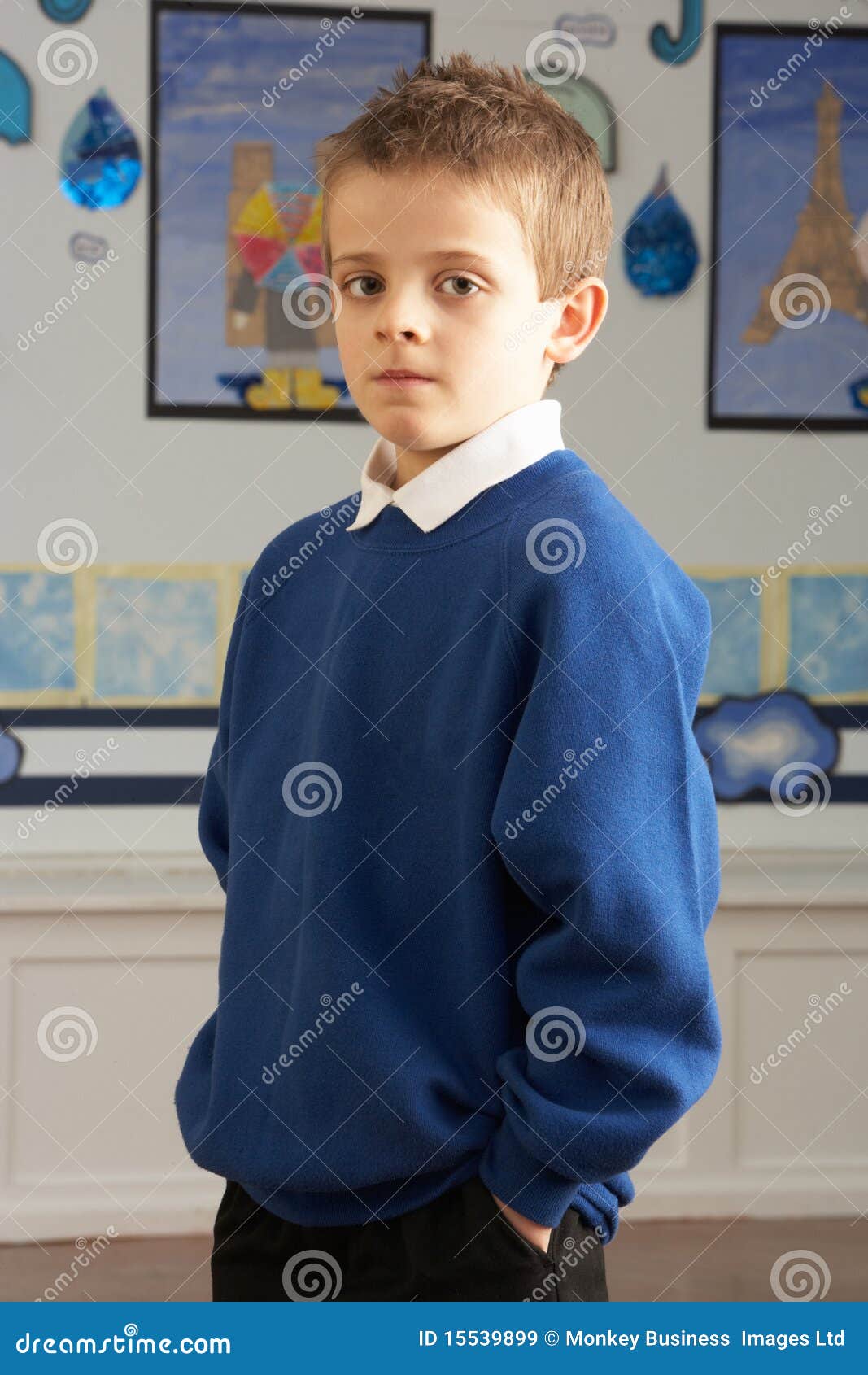 Male Primary School Pupil Standing in Classroom Stock Image - Image of ...