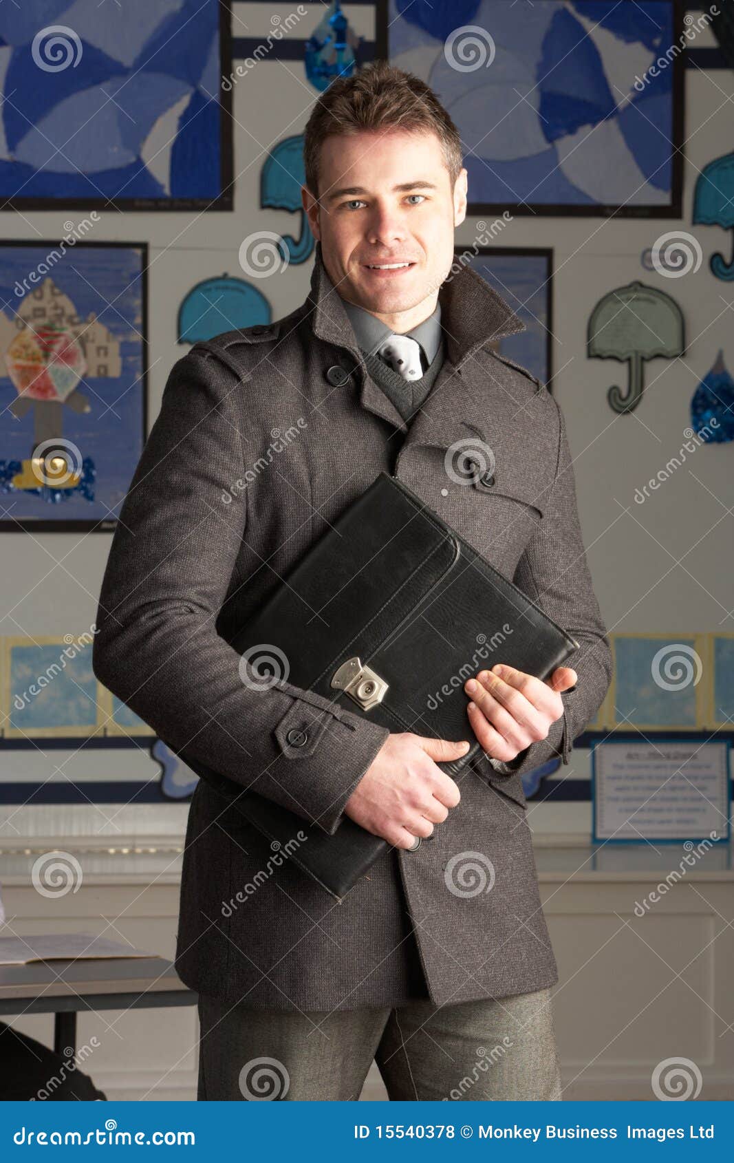Male Primary School Teacher Standing in Classroom Stock Photo - Image ...