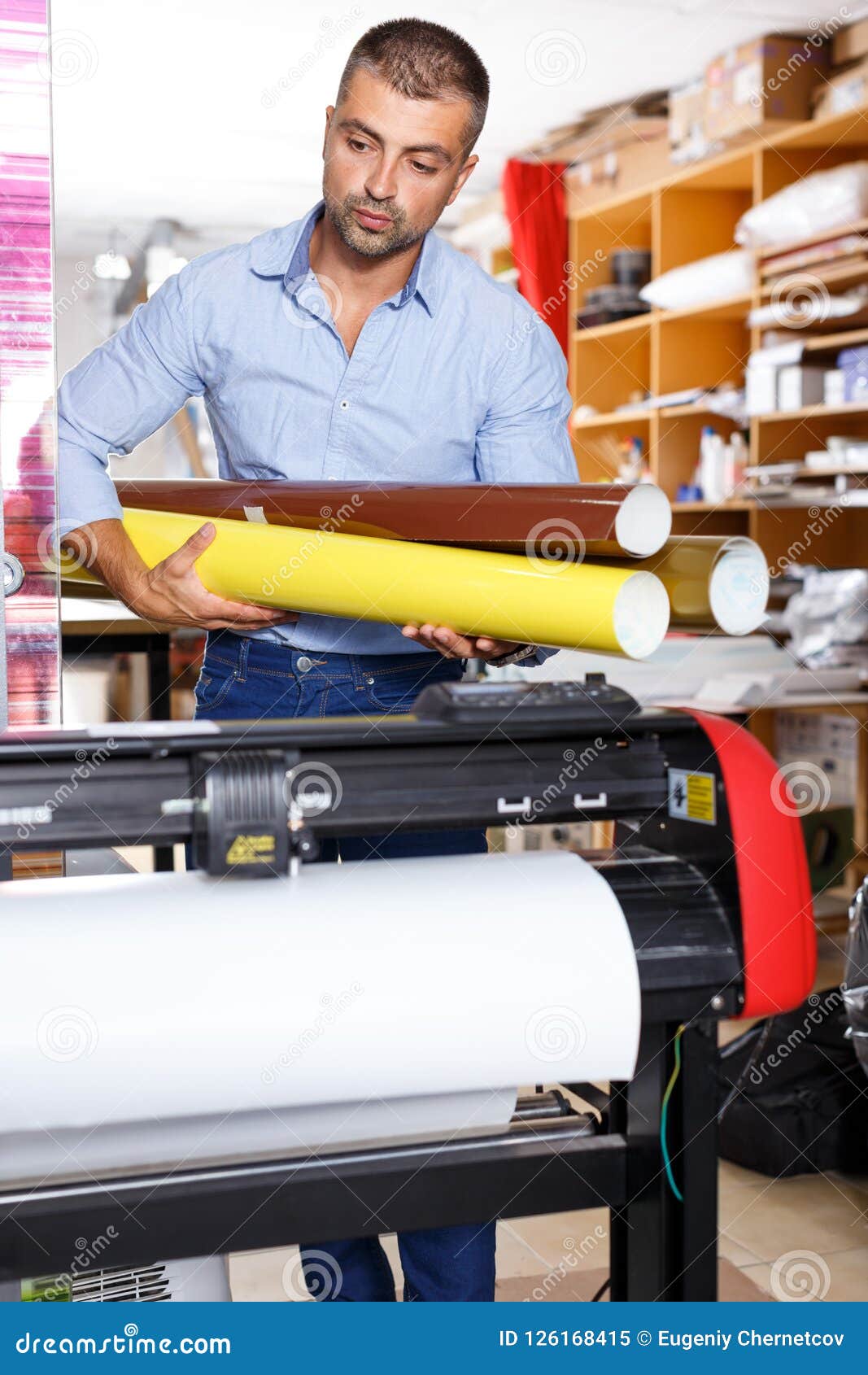 Male Printing Worker with Rolls of Colored Paper Stock Image - Image of ...