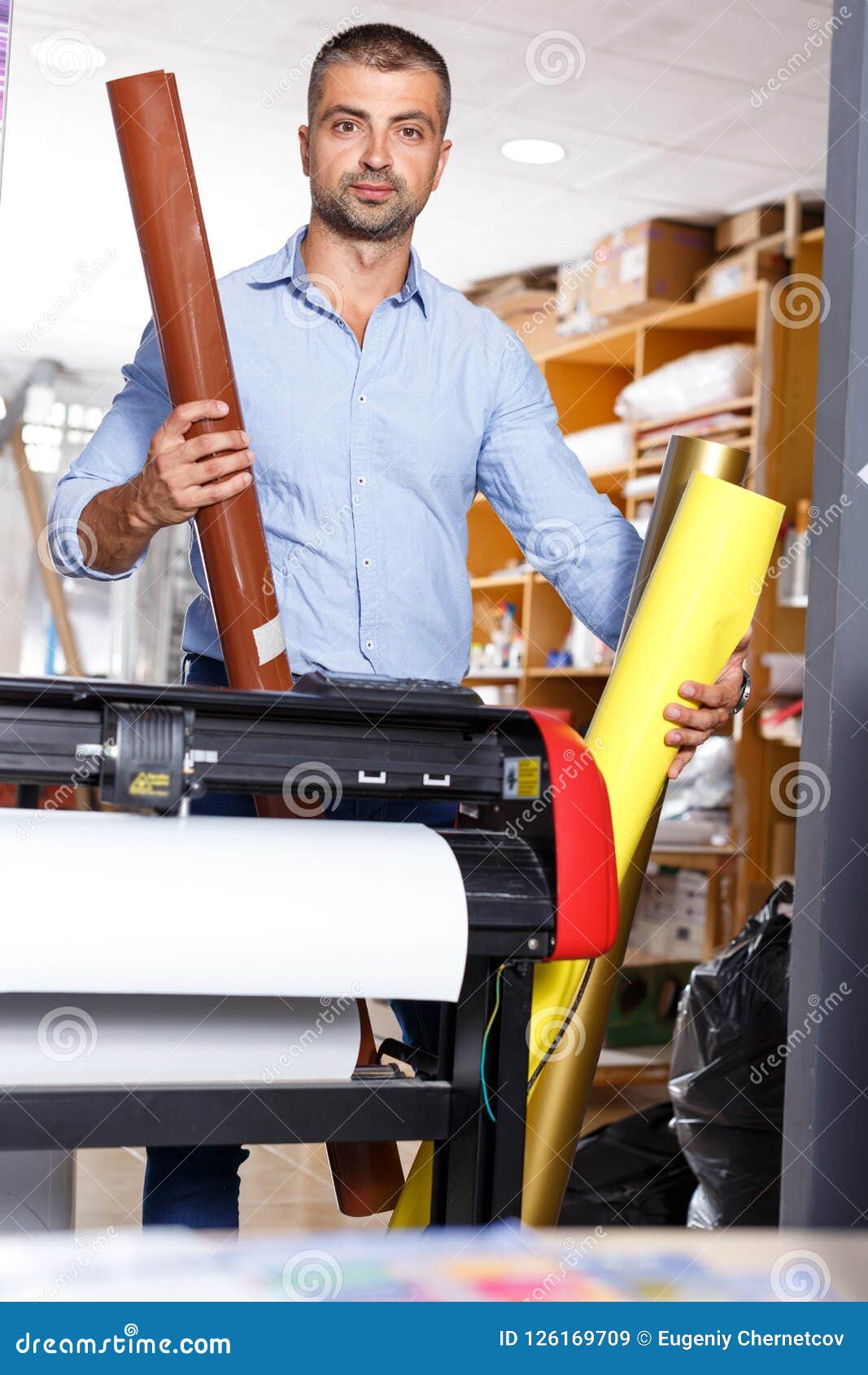 Male Printing Worker with Rolls of Colored Paper Stock Image - Image of ...