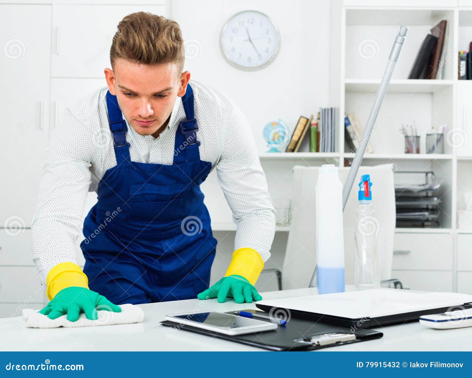 Male Professional Janitor Dusting in Office Stock Photo - Image of ...