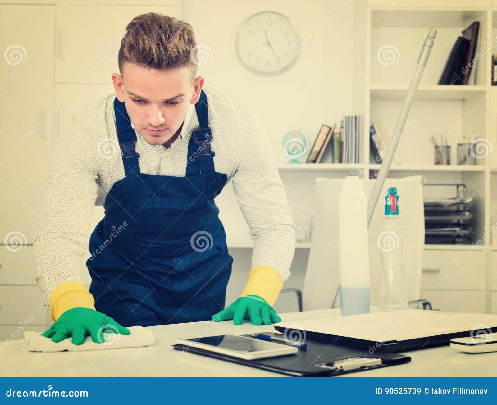 Male Professional Janitor Dusting in Office Stock Image - Image of ...