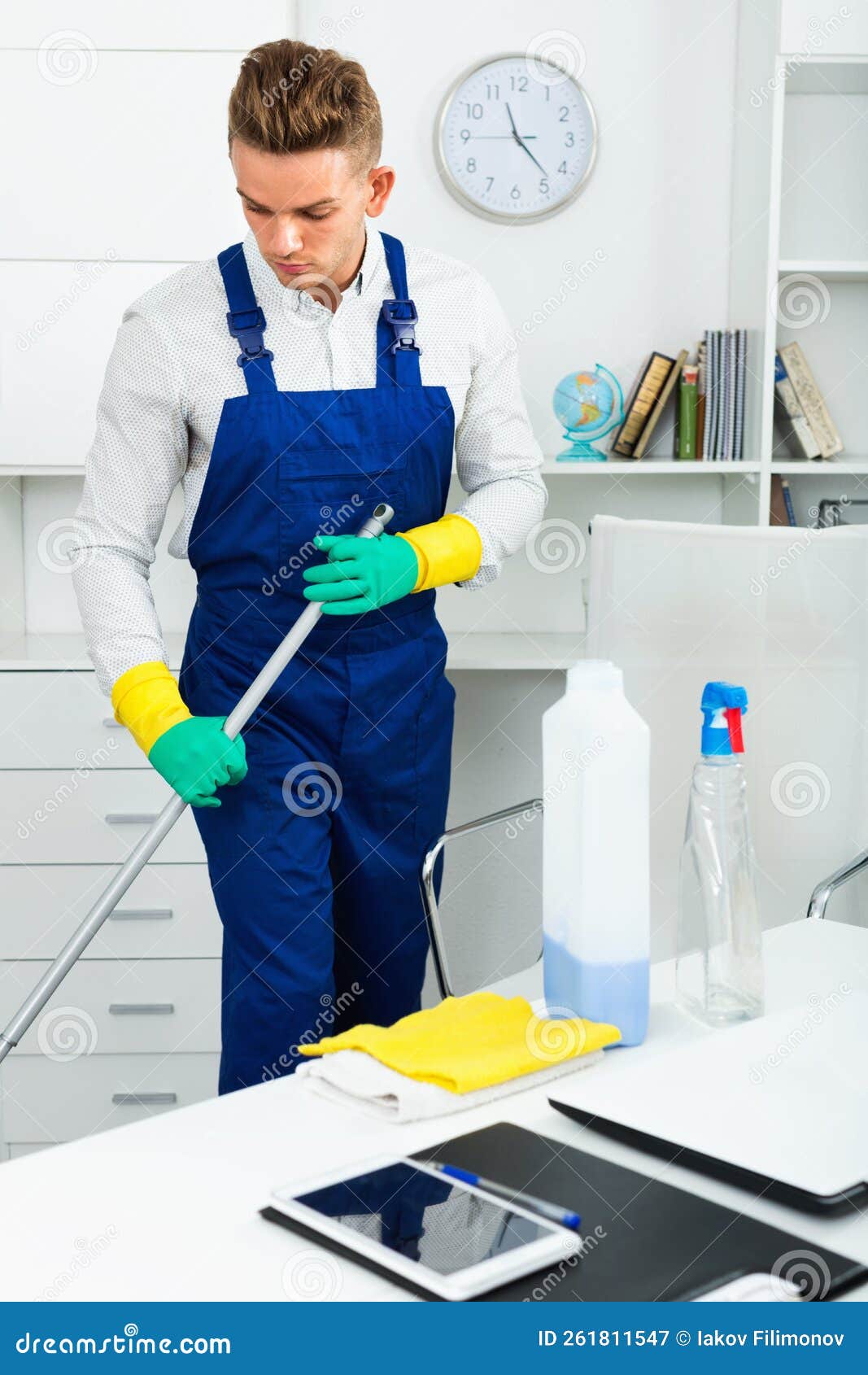 Male Professional Janitor Dusting in Office Stock Image - Image of ...