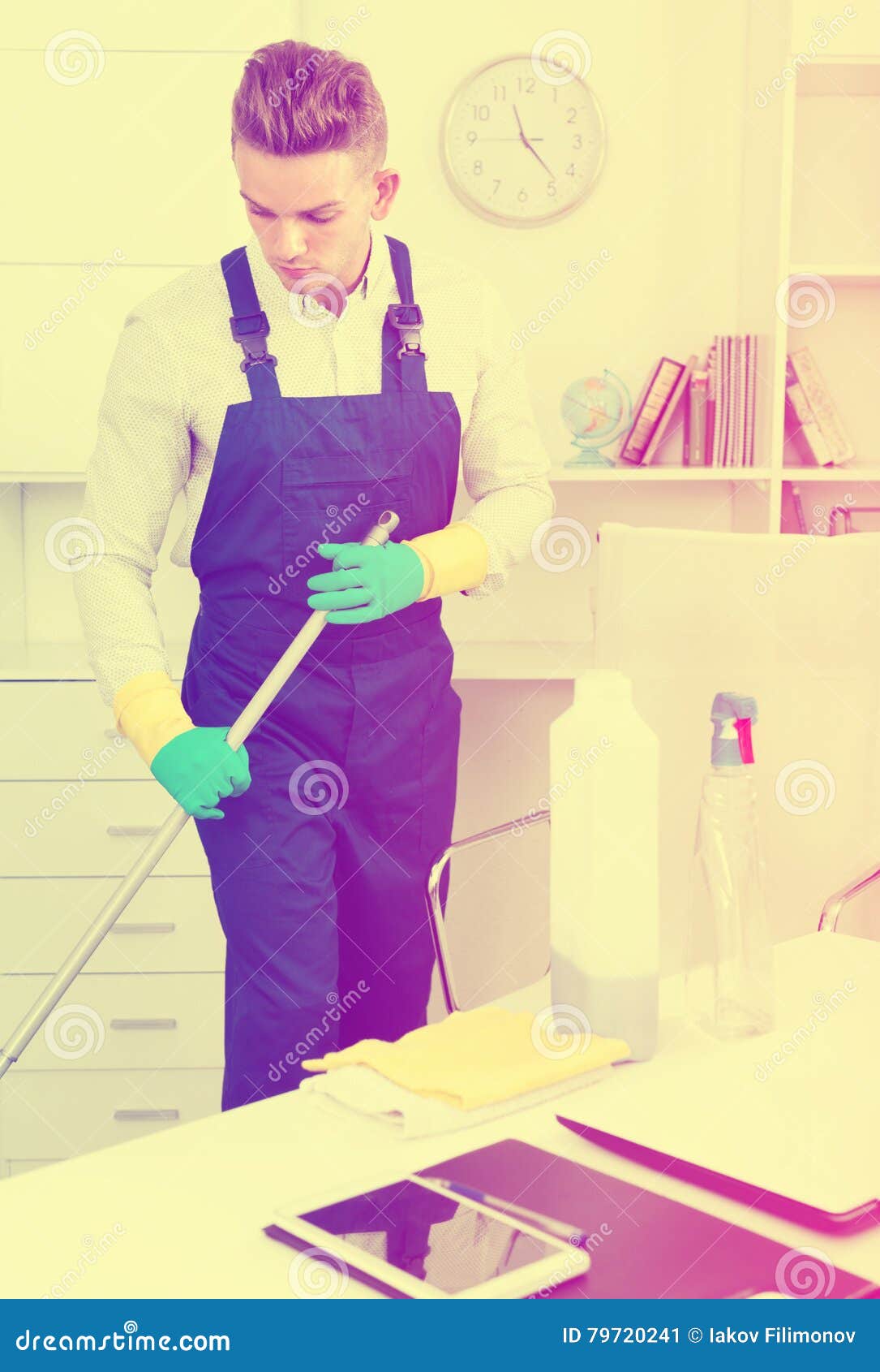 Male Professional Janitor Dusting in Office Stock Image - Image of ...