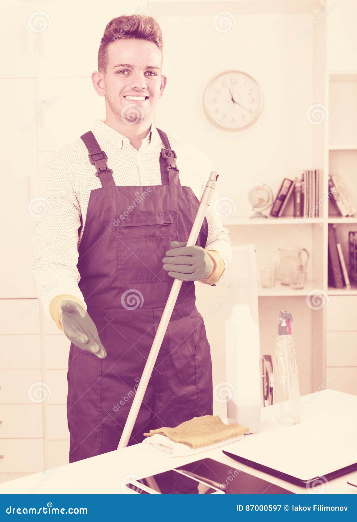 Male Professional Janitor Dusting in Office Stock Image - Image of ...