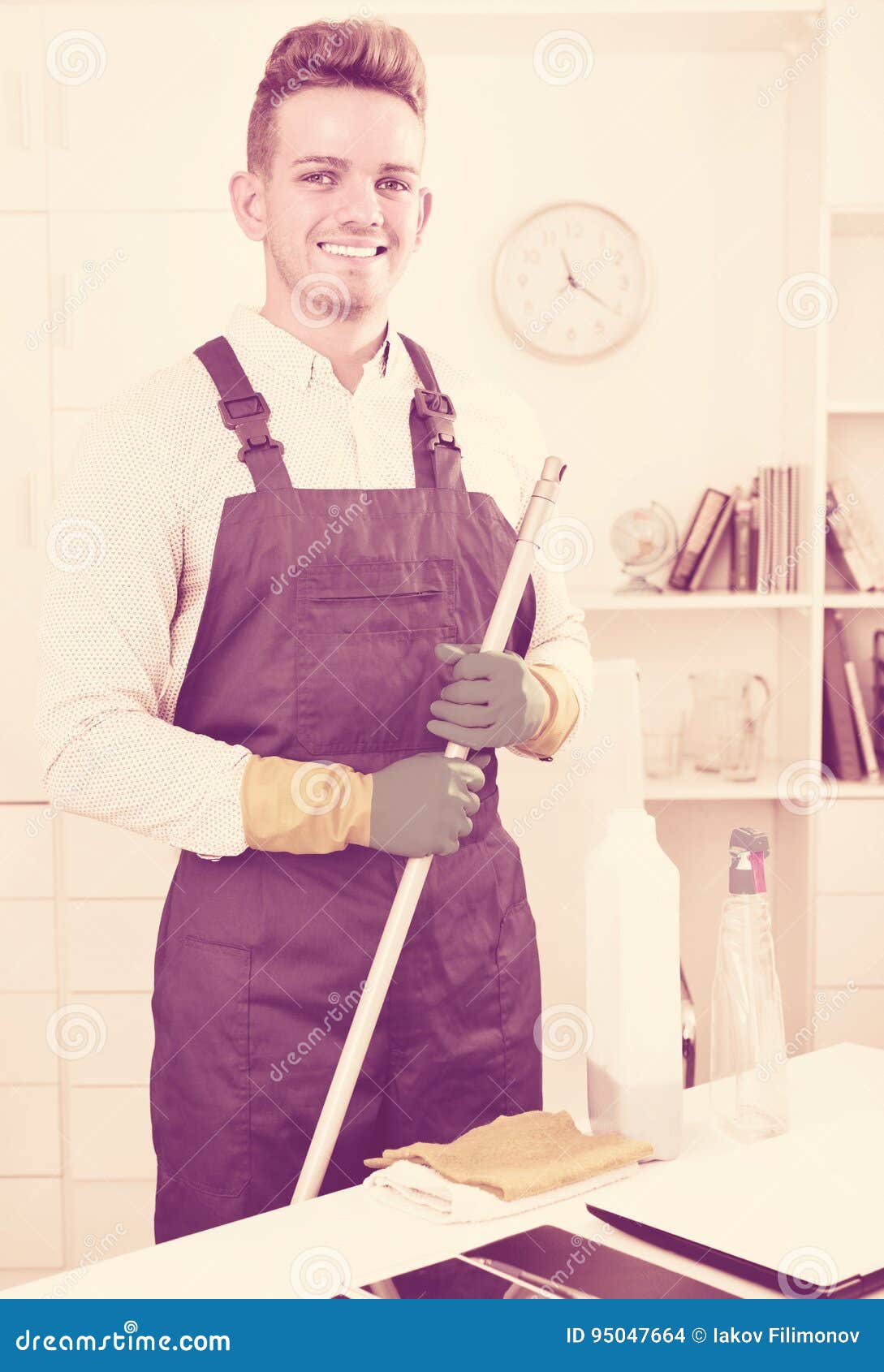 Male Professional Janitor Dusting in Office Stock Photo - Image of ...