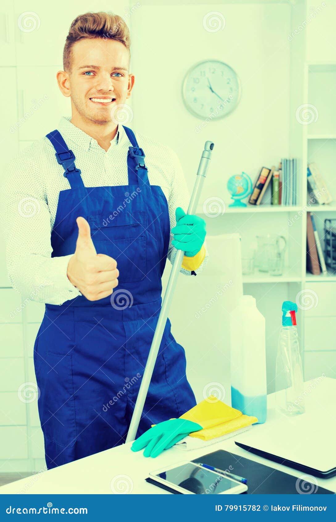 Male Professional Janitor Dusting in Office Stock Photo - Image of ...