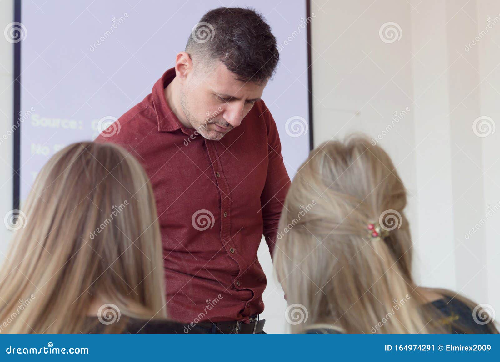 Male Professor Explain Lesson To Students and Interact with Them in the ...