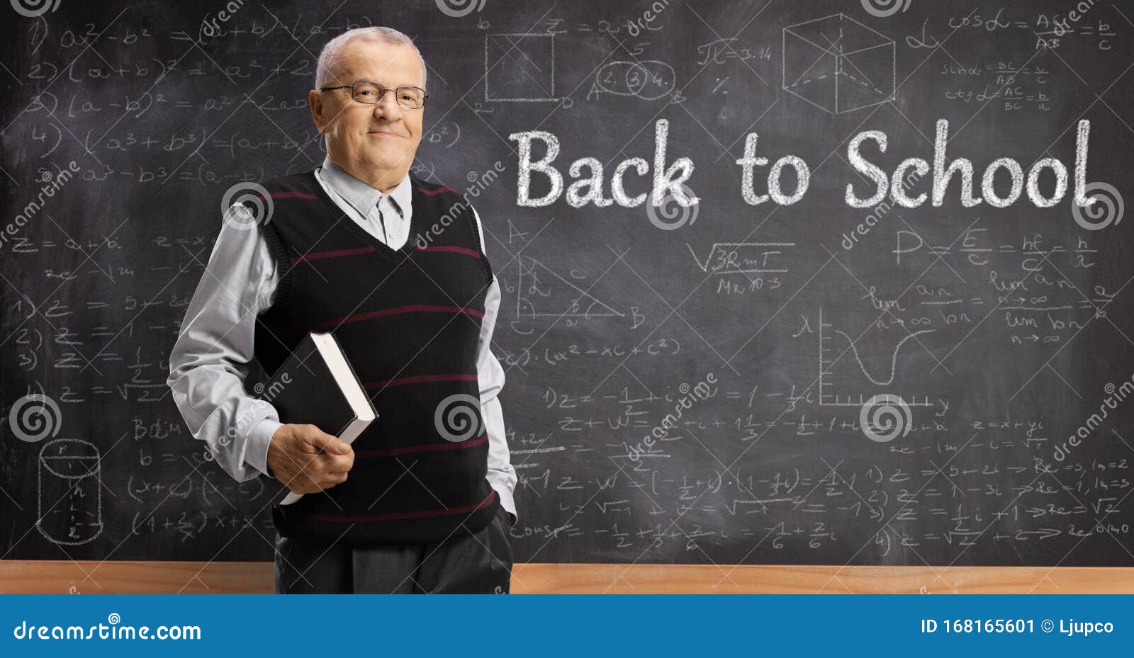 Male Professor Standing Next To a Blackboard with Text Back To School ...