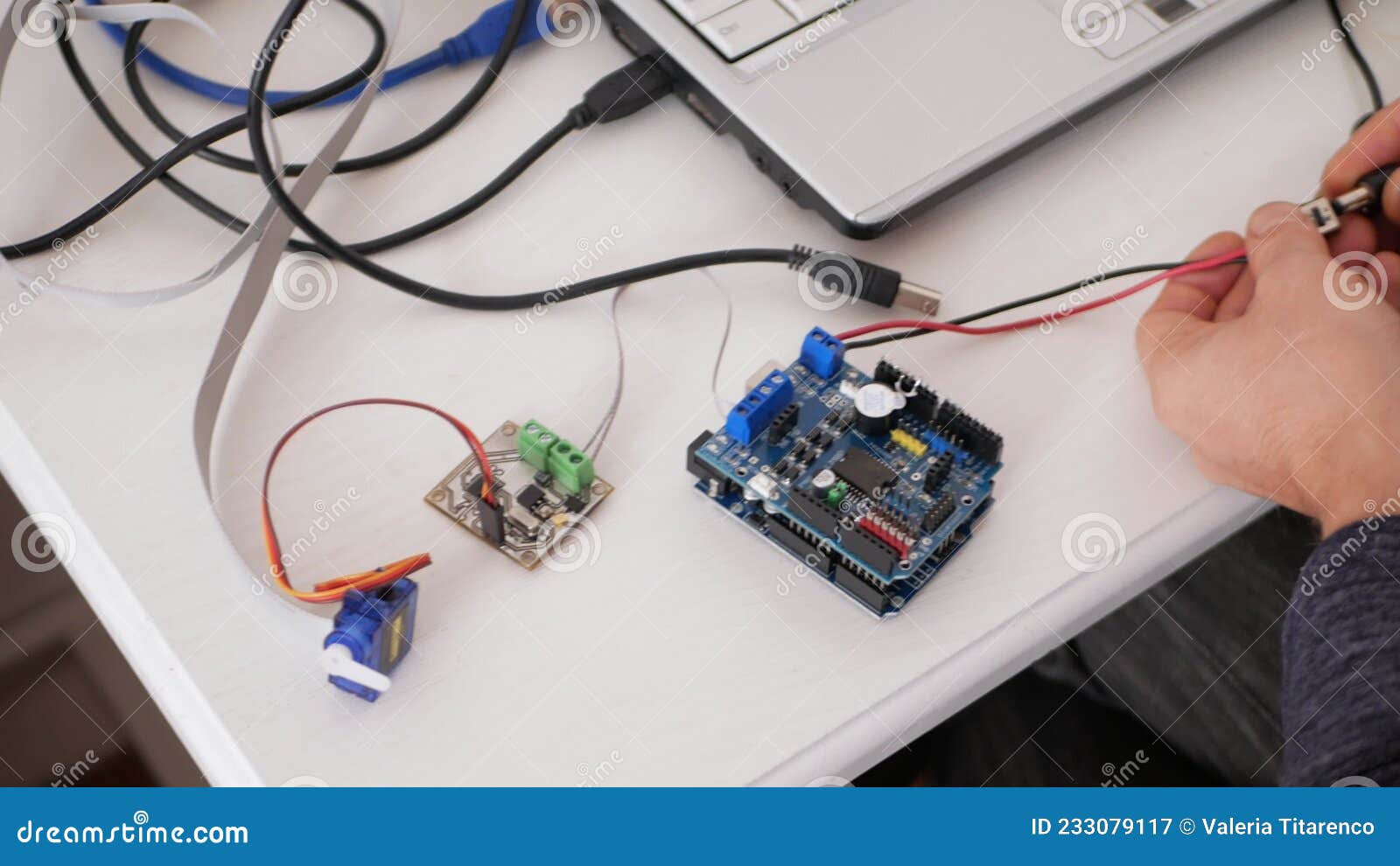 Male Programmer Creates Robotics, an Arduino Board Controls Servo ...