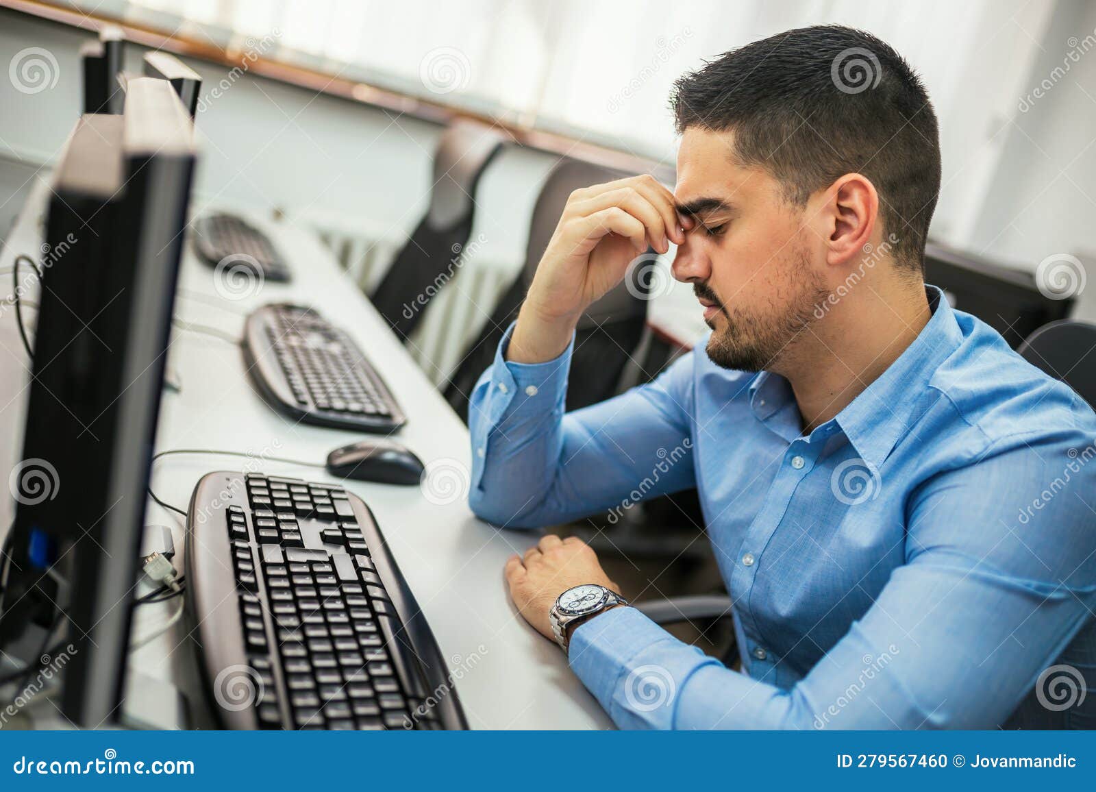 Programmer Having a Headache while Working on PC in the Office Stock ...