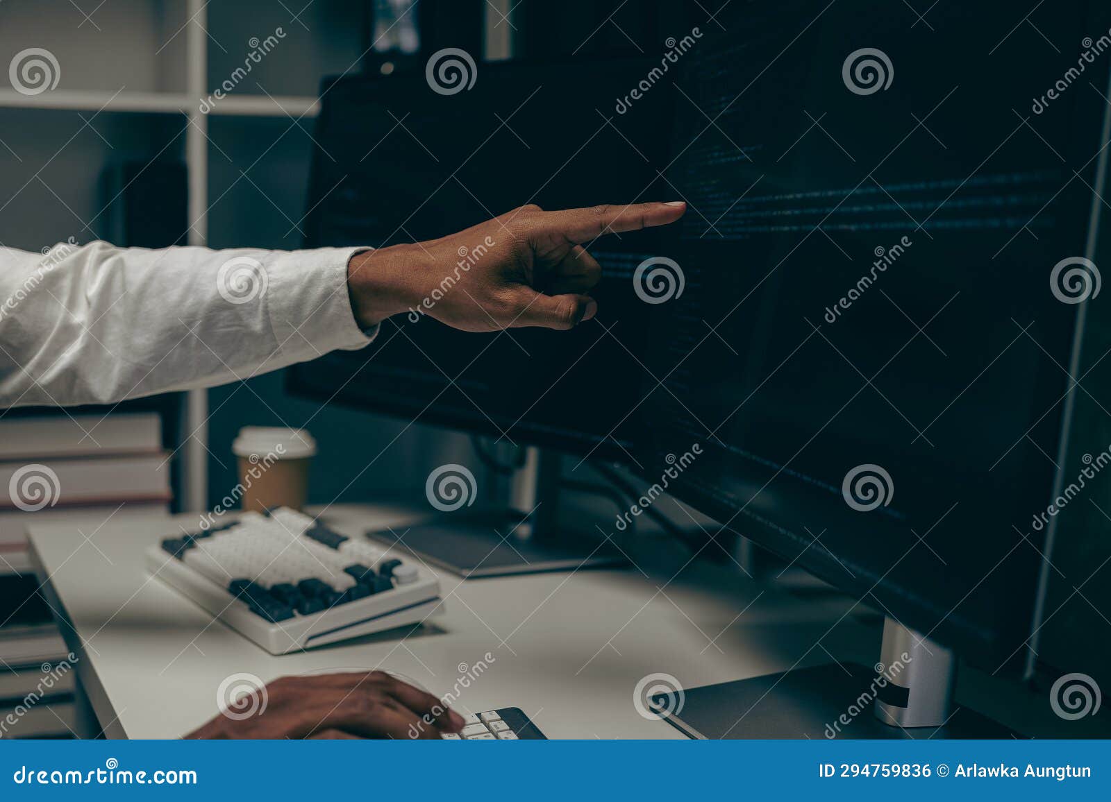 Male Programmer Working On Desktop Computer At White Table In Office