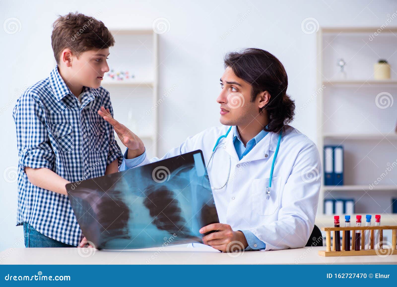 Male Radiologist Looking at Boy`s Images Stock Photo - Image of health ...