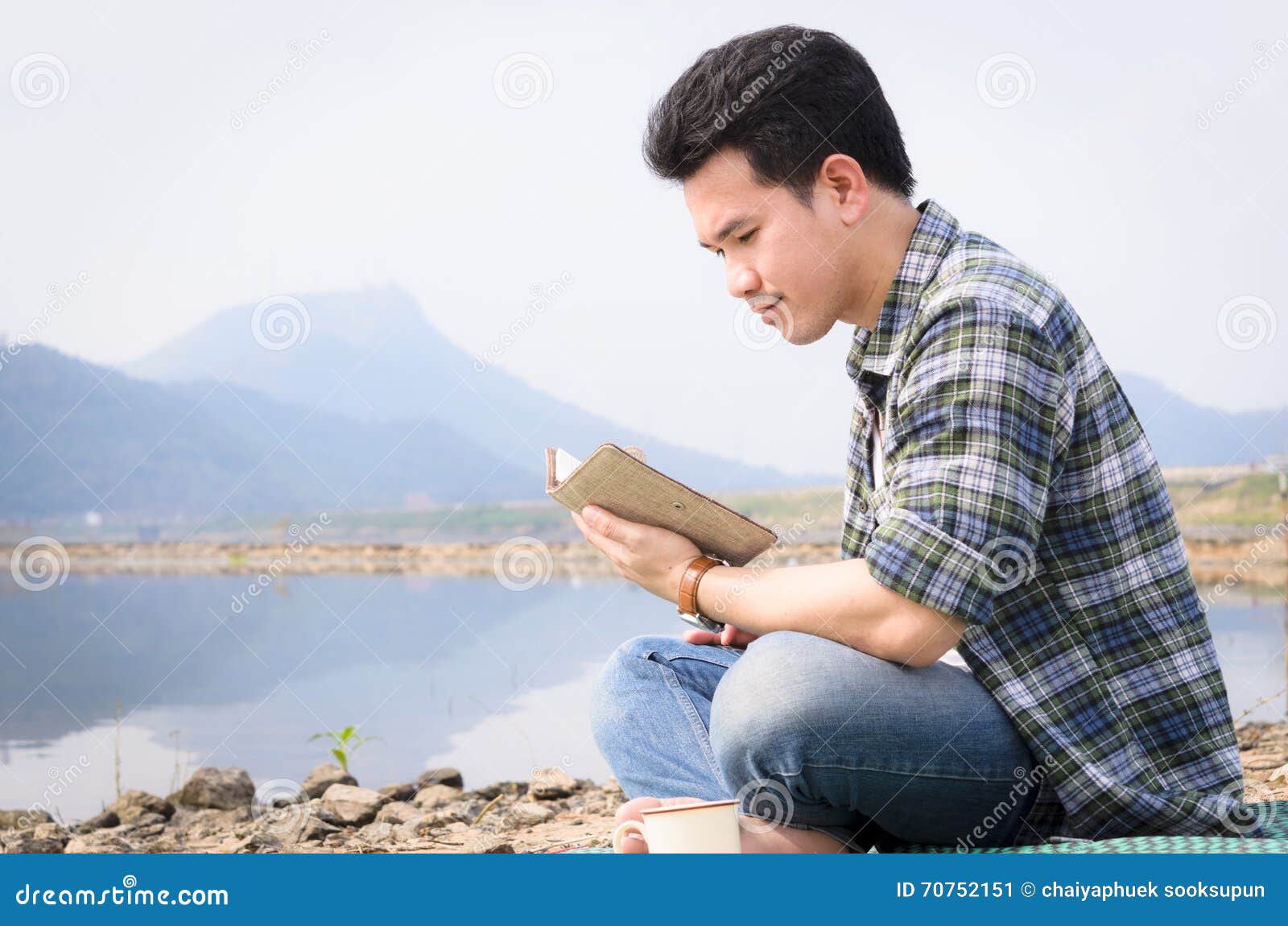 Male Reading a Book in the Park on a Summers Day River Side. Stock ...