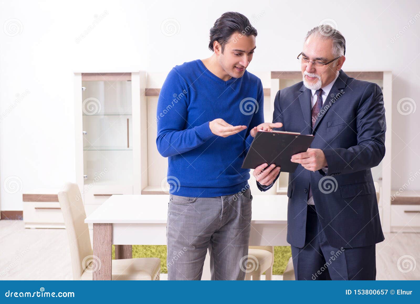 Male Real Estate Agent and Male Client in the Apartment Stock Image ...
