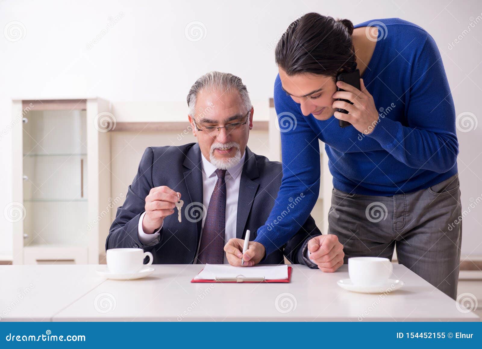 Male Real Estate Agent and Male Client in the Apartment Stock Image ...