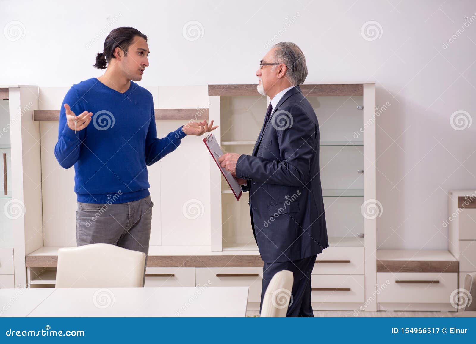 Male Real Estate Agent and Male Client in the Apartment Stock Image ...