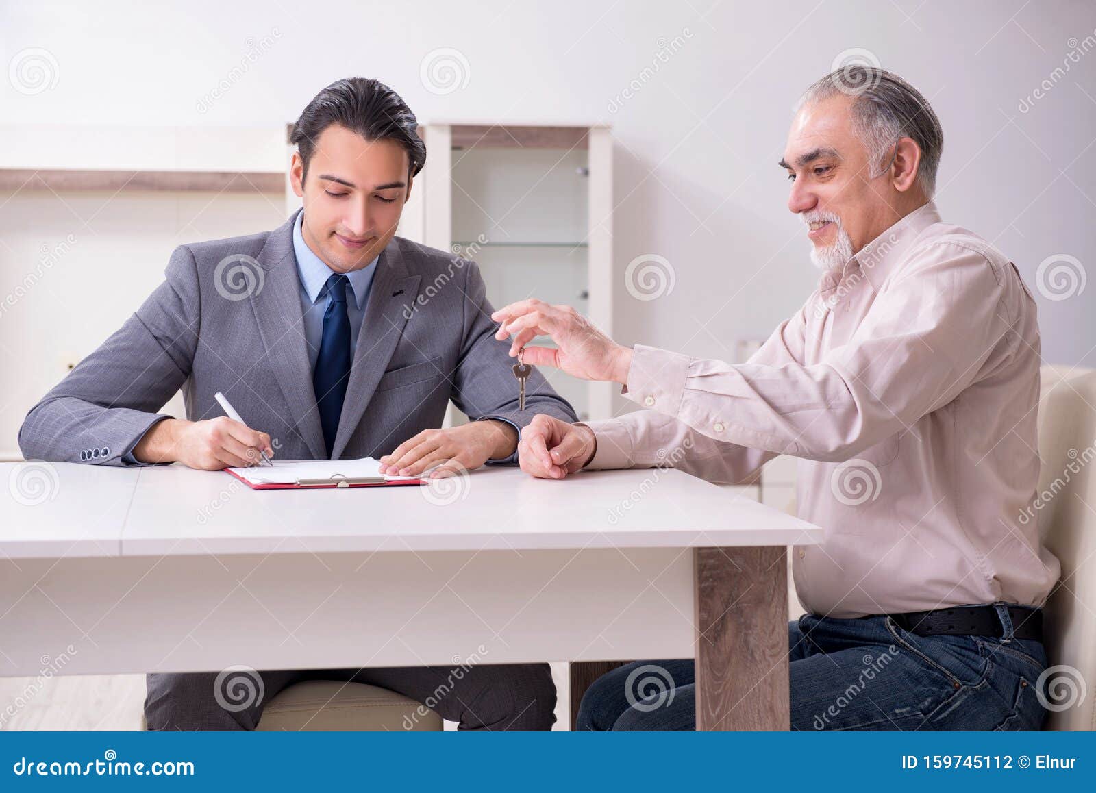 Male Real Estate Agent and Male Client in the Apartment Stock Photo ...