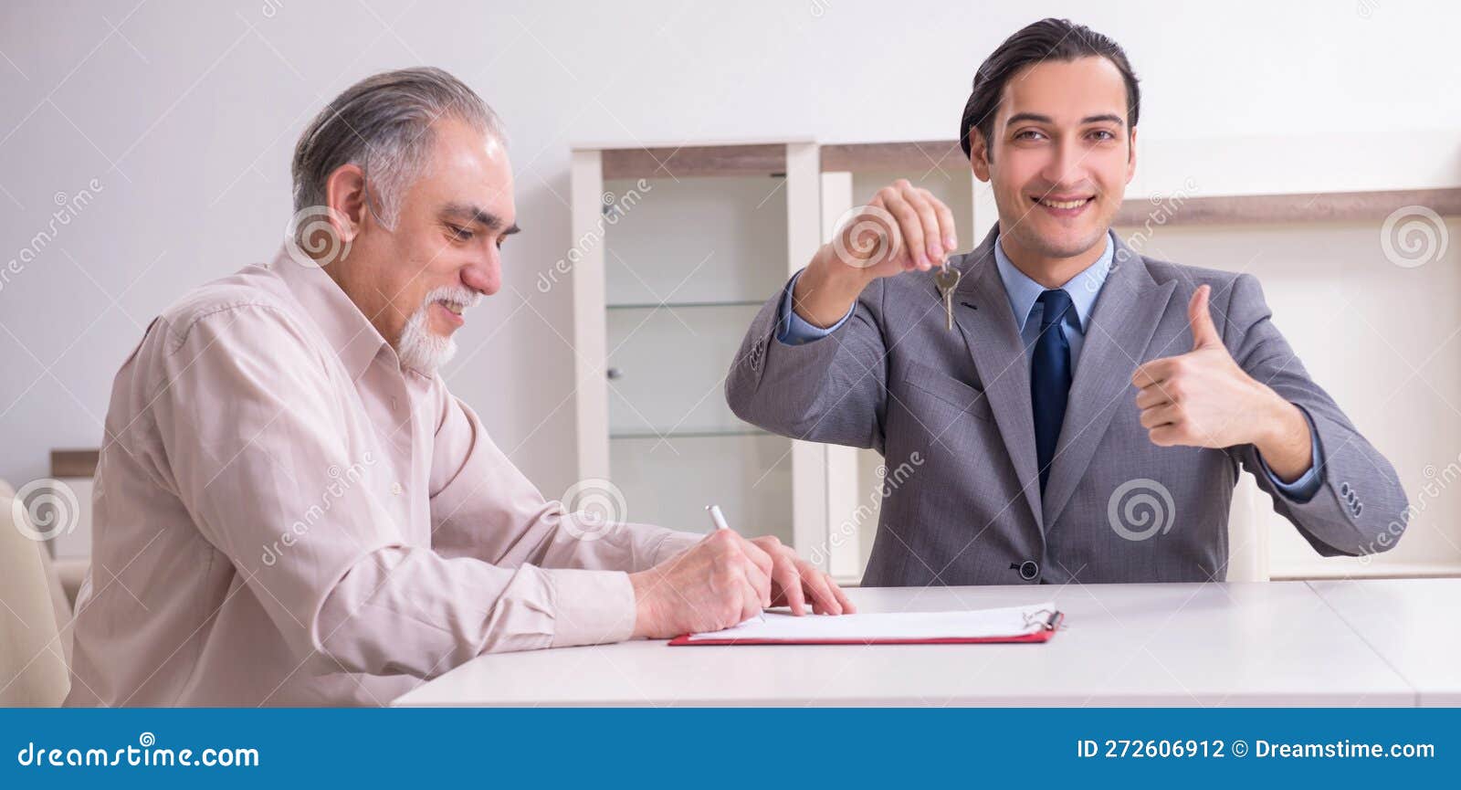 Male Real Estate Agent and Male Client in the Apartment Stock Photo ...
