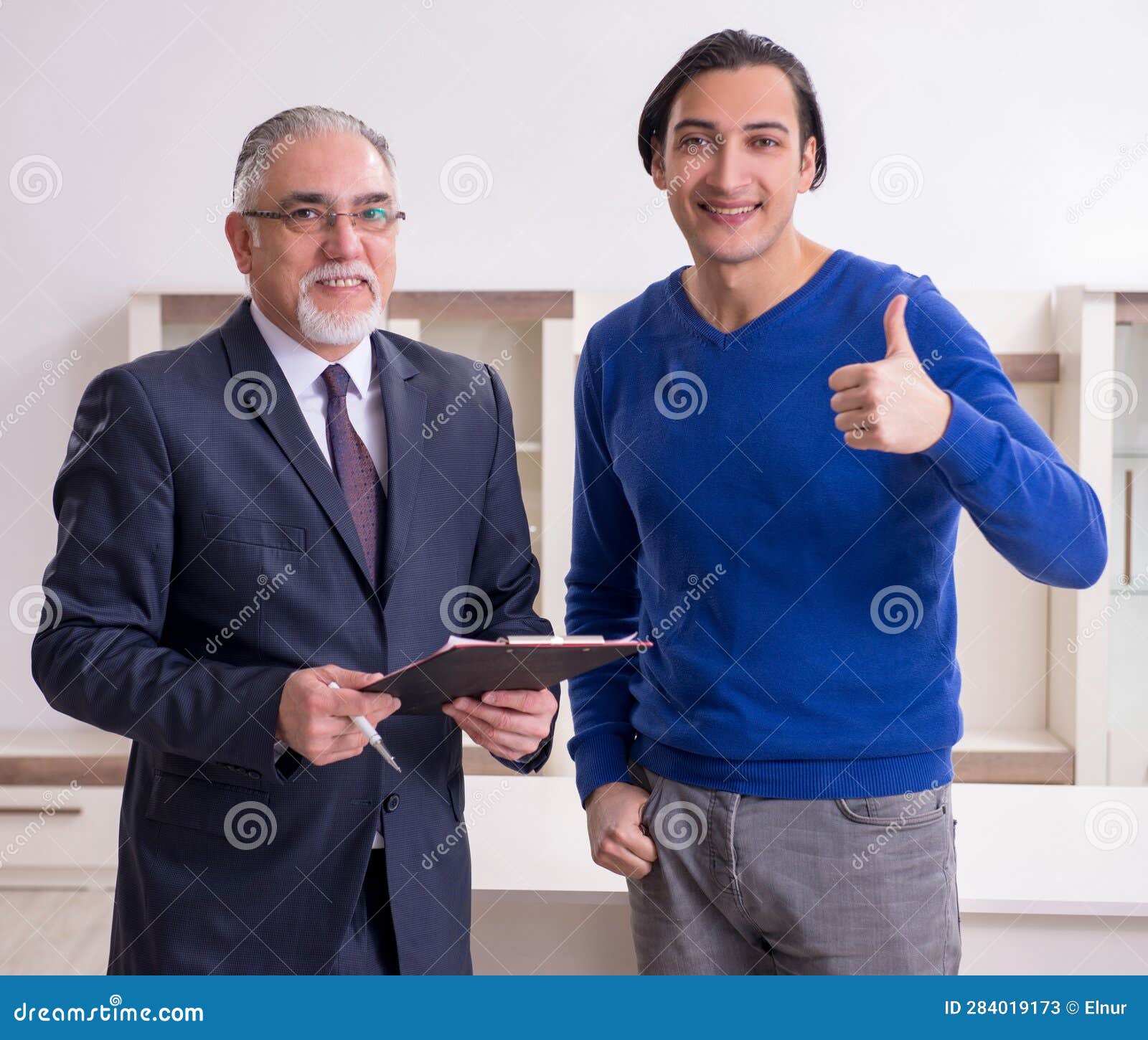 Male Real Estate Agent and Male Client in the Apartment Stock Image ...