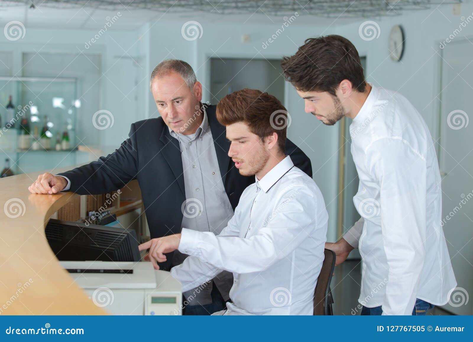 Male Receptionist Questioning Manager Stock Image - Image of ...