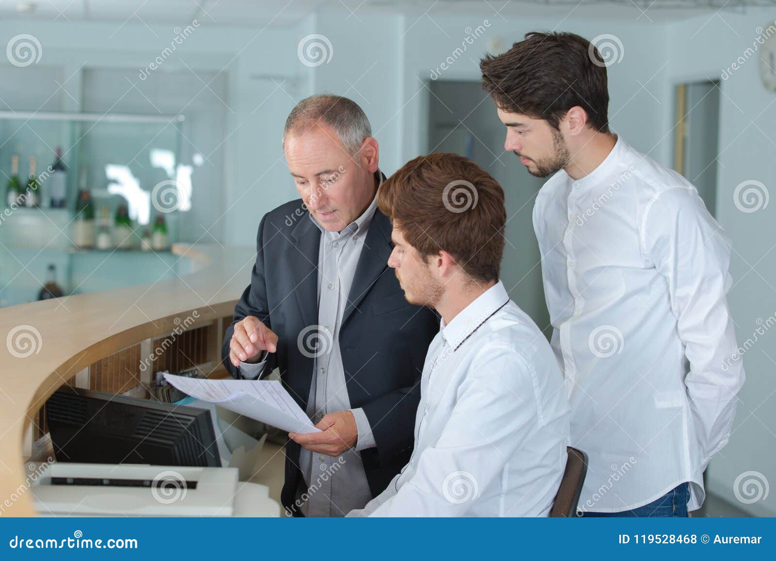 Male Receptionists Locating at Counter Stock Photo - Image of lobby ...